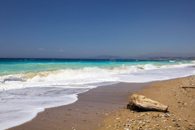 Sandy Beach with Sea of Many Colors and Clear Skies Stock Photo - Image ...
