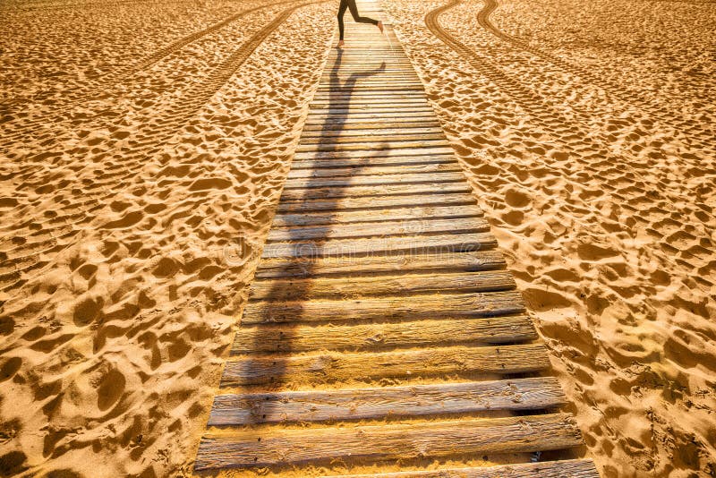 Sandy Beach with Shadow of Running Woman Stock Photo - Image of people ...