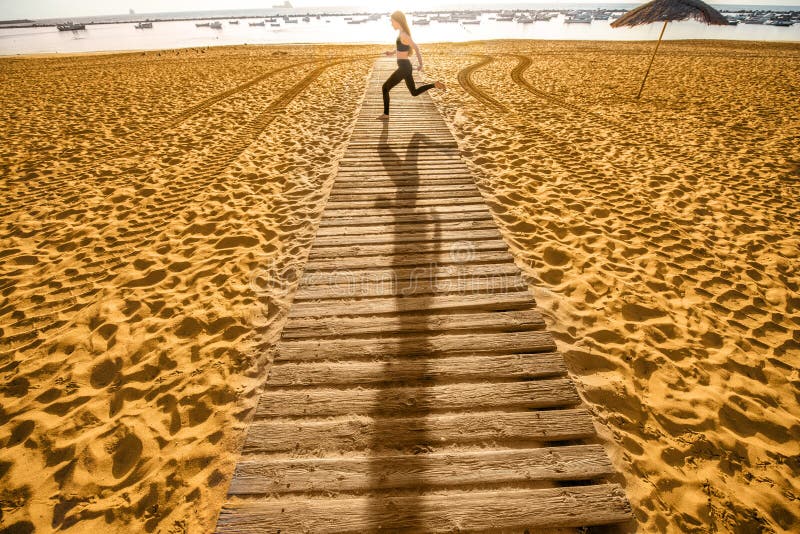Sandy Beach with Shadow of Running Woman Stock Photo - Image of sunny ...