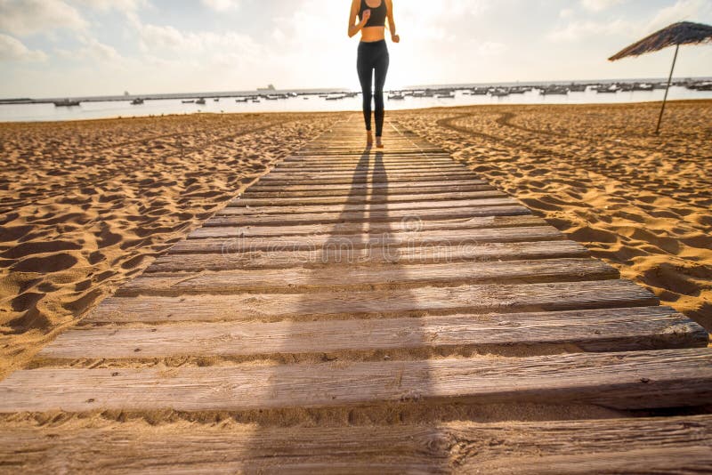 Sandy Beach with Shadow of Running Woman Stock Photo - Image of shadow ...