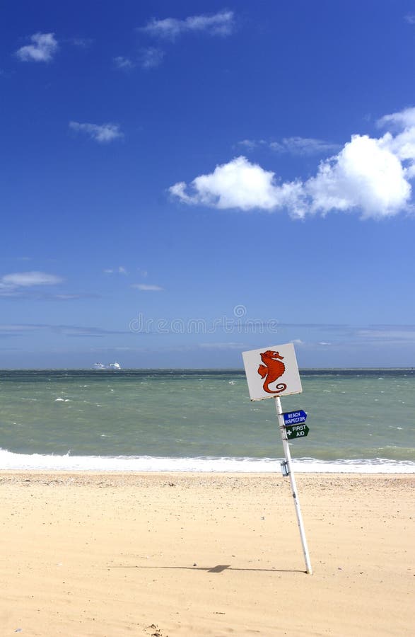 Sandy beach and sign stock image. Image of sign, british - 873273