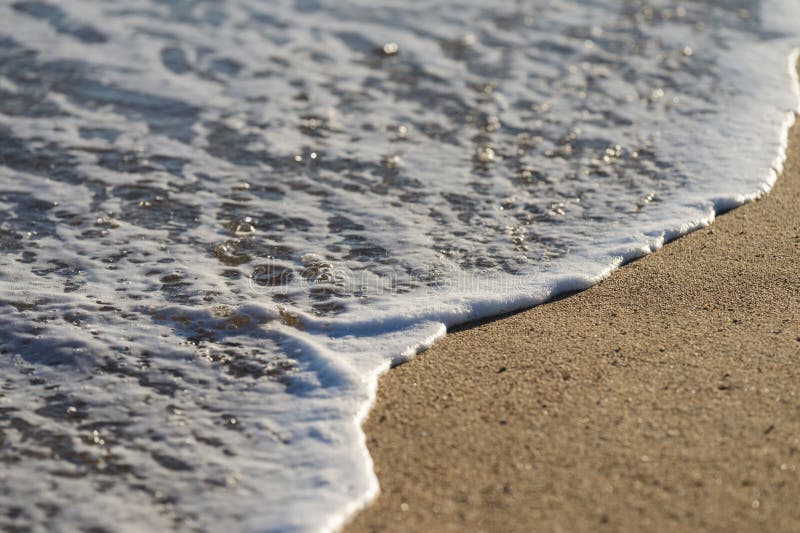 Sandy Beach with Small Waves Background Stock Image - Image of seashore ...