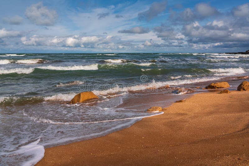 Sandy Beach, Small Waves and Blue Sky with Clouds Stock Image - Image ...
