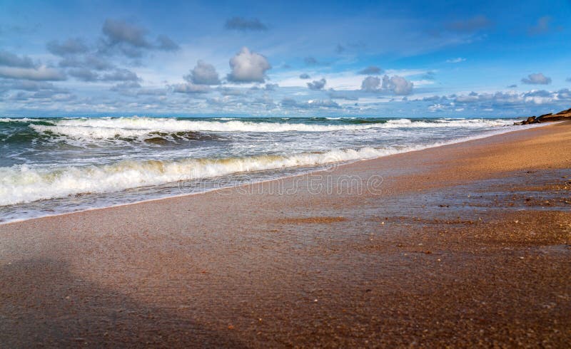 Sandy Beach, Small Waves and Blue Sky with Clouds Stock Image - Image ...
