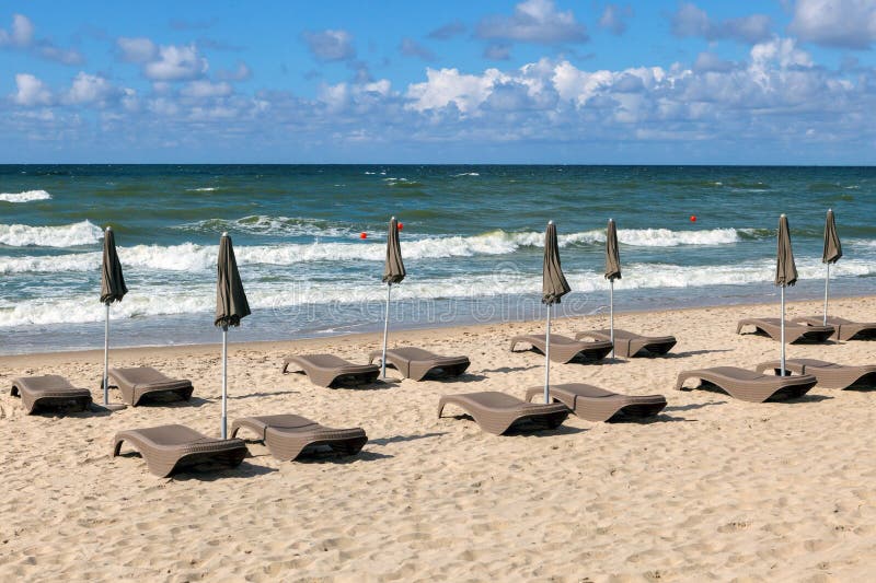 Sandy Beach with Sun Loungers and Umbrellas, without People Stock Image ...