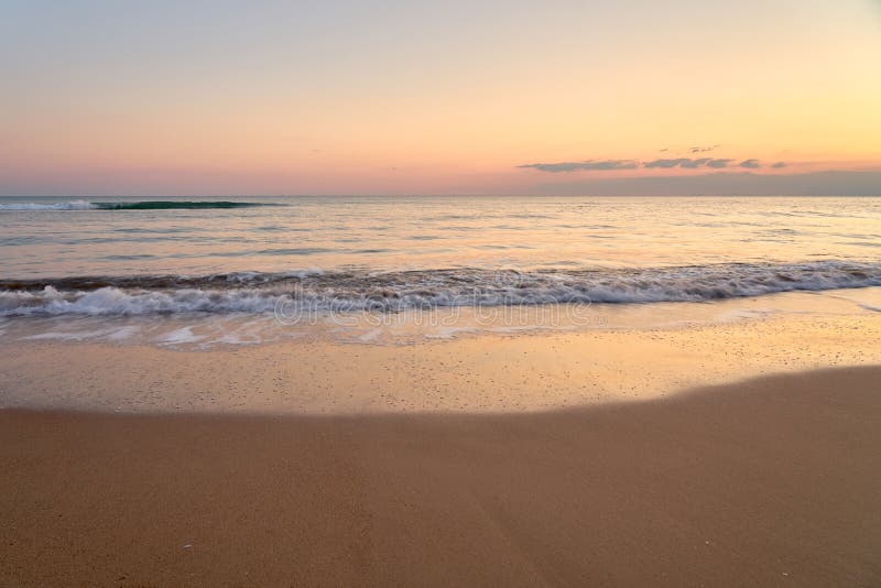 Sandy Beach on a Sunset with Reflection on Wet Sand and Waves with Foam ...