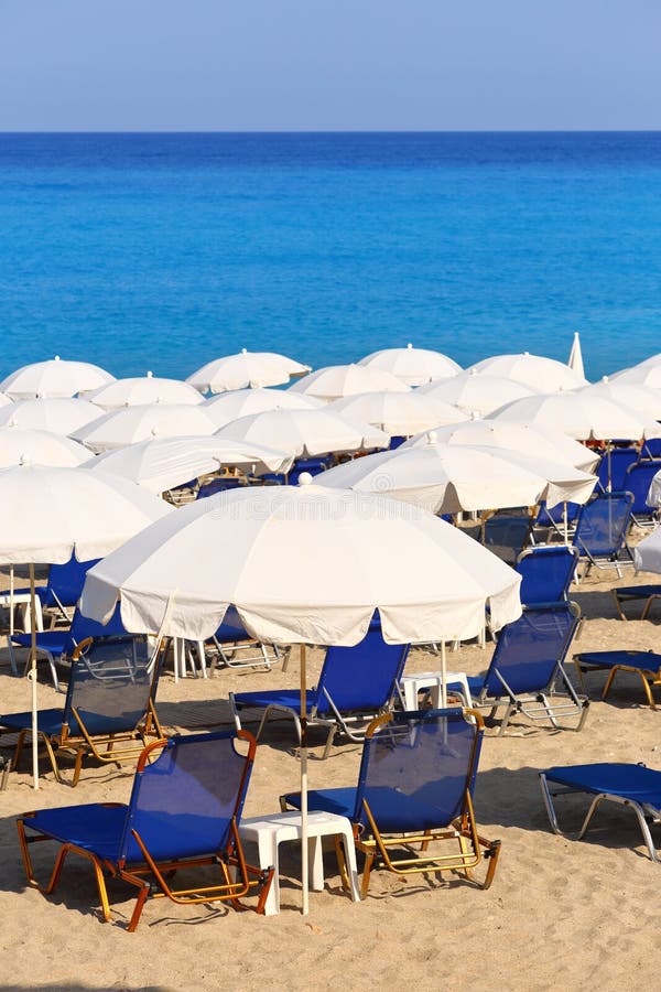White Parasols, Sun Beds and Freshly Combed Sand at the Beach Stock ...