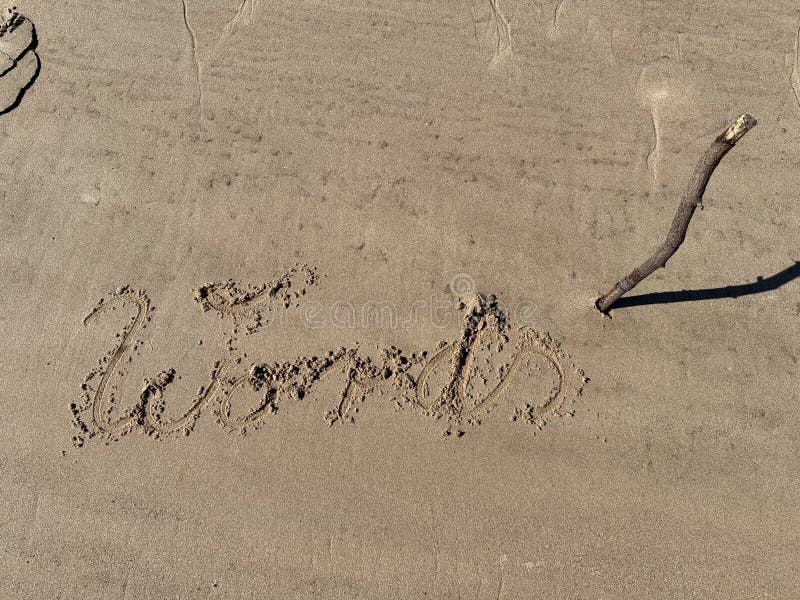 In a Sandy Beach the Word Words is Written with a Stick Stock Image ...