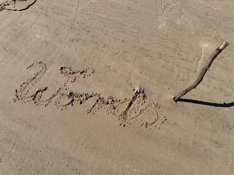 In a Sandy Beach the Word Words is Written with a Stick Stock Image ...