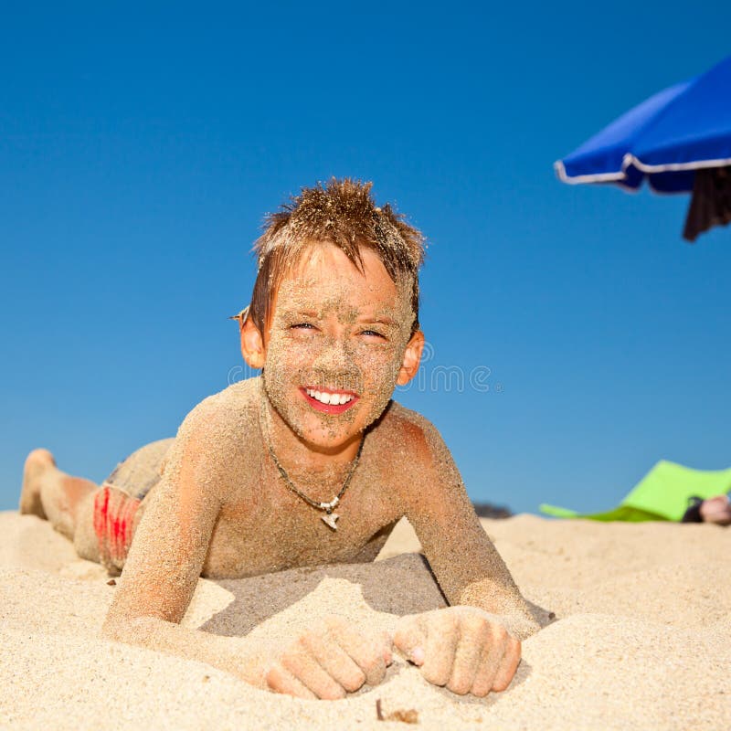 Boy on a beach stock image. Image of sand, lying, caucasian - 36063297