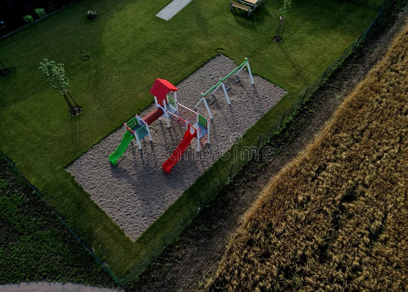 Sandy Children Playground Bordered by Tree Trunks and Sandstone ...