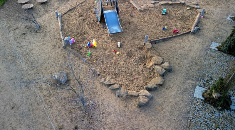 Sandy Children Playground Bordered by Tree Trunks and Stock Image ...
