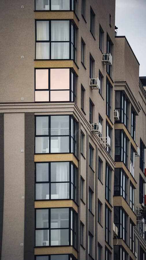 Sandy Horizon: Beige Skyscraper with Gridded Azure Windows Stock Image ...