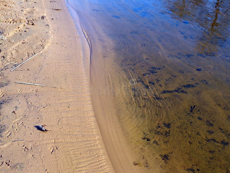 Sandy lakeside stock image. Image of bottom, river, sand - 32550177