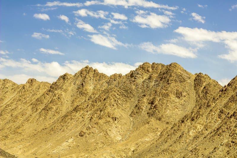 A Sandy Mountains and White Clouds Stock Image - Image of highlands ...