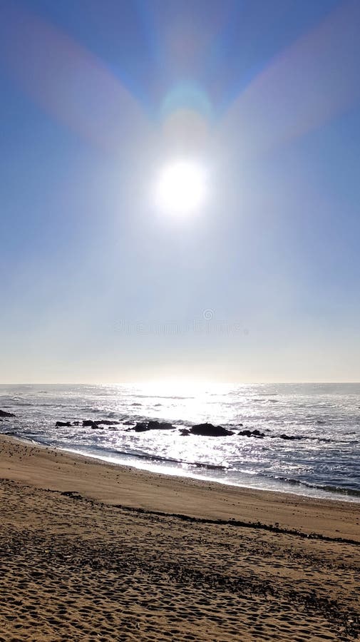 Sandy Ocean Shore. the Sun is Shining Brightly in the Blue Sky ...