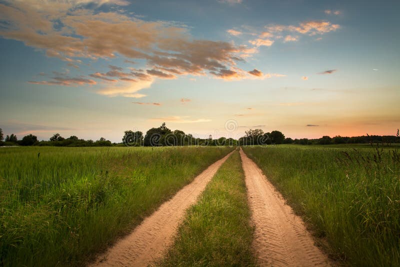 Sandy Road through Fields and Cloud on the Evening Sky Stock Photo ...