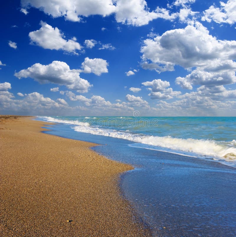 Sandy Sea Beach with Waves Under Cloudy Sky Stock Photo - Image of ...