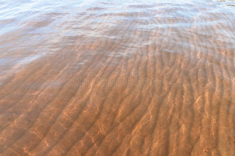 Sandy Seabed with Wavy Relief is Under Shallow Water Stock Photo ...