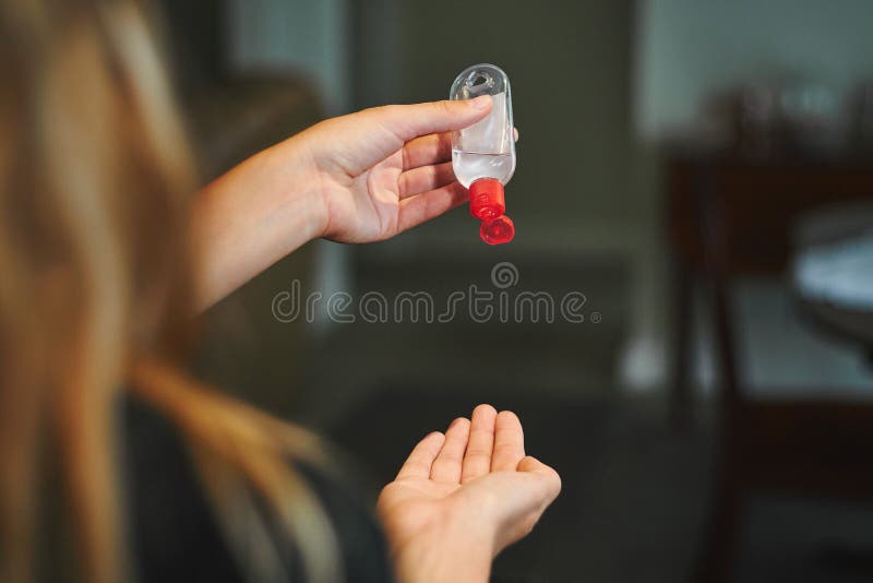 Hand sanitizing at home stock photo. Image of caucasian - 257122216