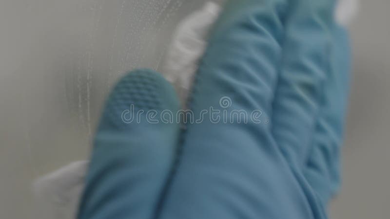 Sanitizing Surface with Gloved Hand Using White Cloth in Close-up Indoor Scene, Illustrating ...
