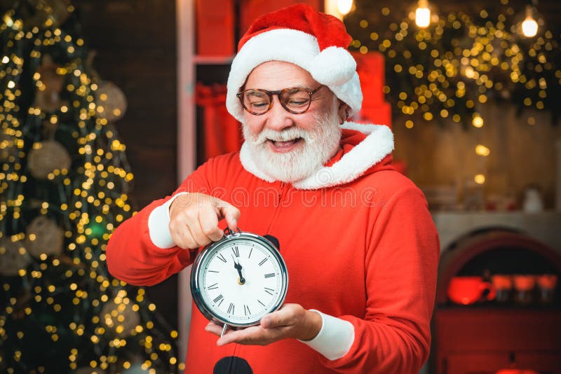 Santa Claus with Alarm Clock. Santa Claus is Looking at His Watch ...