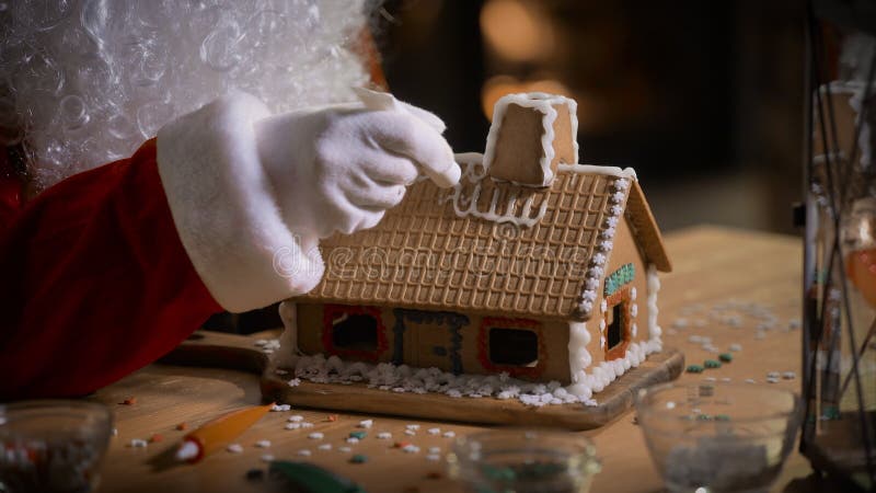 Santa Claus Decorating A Gingerbread House Stock Footage Video Of