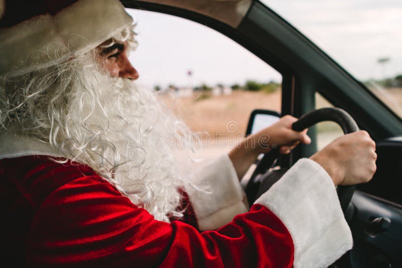 Santa Claus driving a van stock photo. Image of driver - 164496734