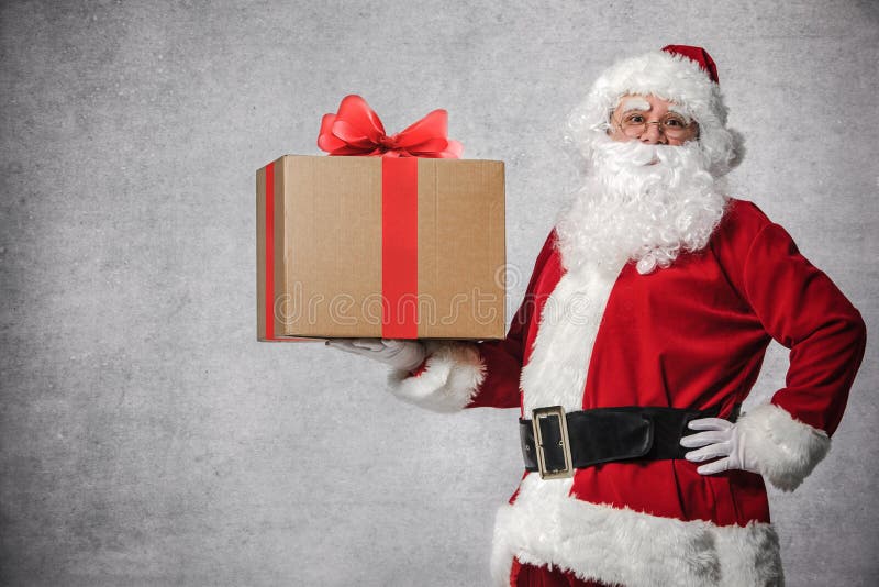 Santa Claus with gift box stock photo. Image of show - 58864166