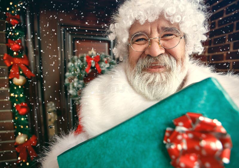 Santa Claus with gift stock photo. Image of claus, male - 165368876