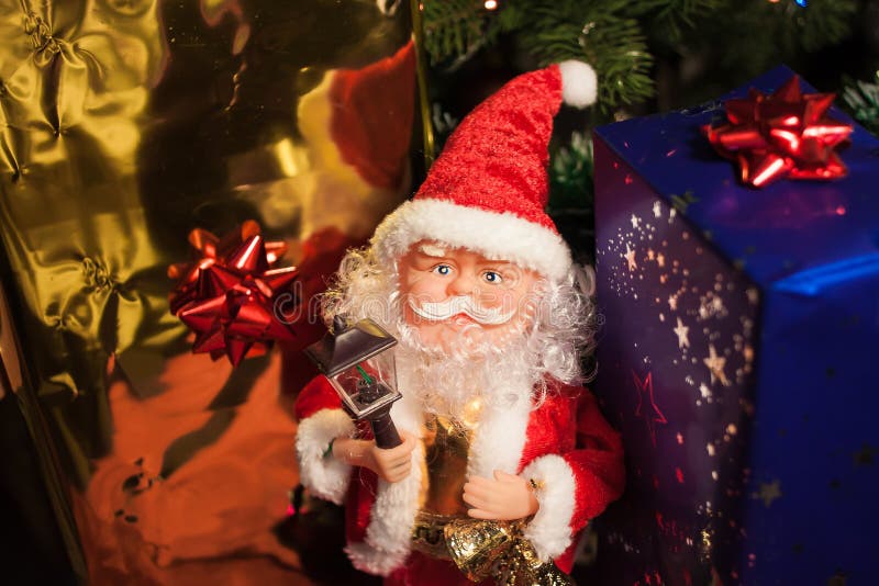 Santa Claus with Gift Package Stock Photo - Image of chtistmas, garland ...