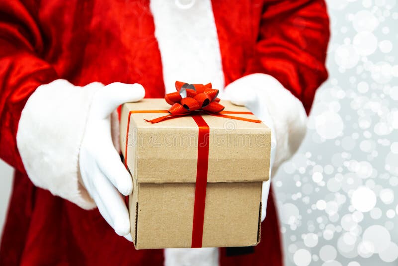Santa Claus Gloved Hands Holding a Gift Box Stock Image - Image of ...