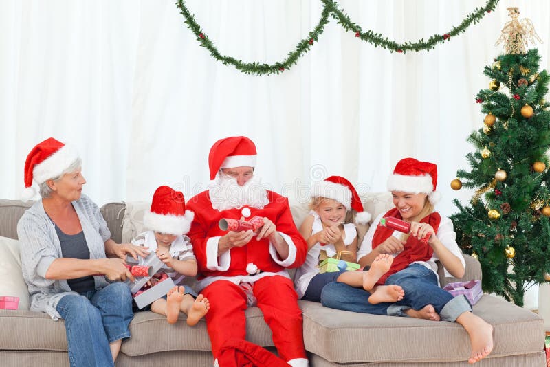 Santa Claus With A Happy Family Stock Photo - Image of christmas, santa ...