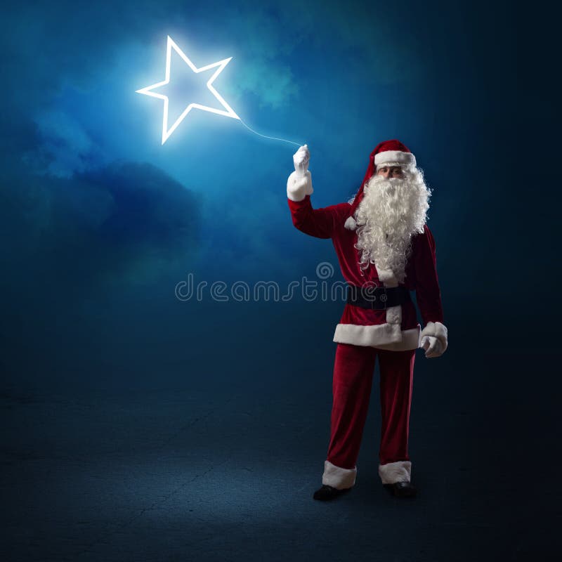 Santa Claus is Holding a Shining Star Stock Photo - Image of jolly ...