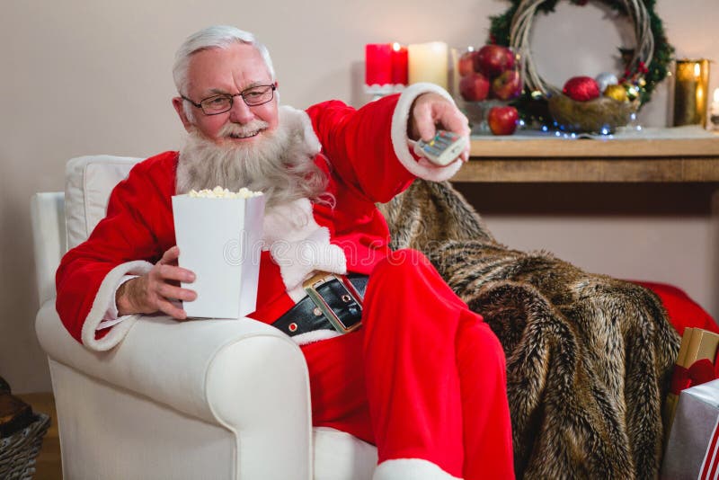 Santa Claus Holding Television Remote Control Foto de archivo - Imagen ...