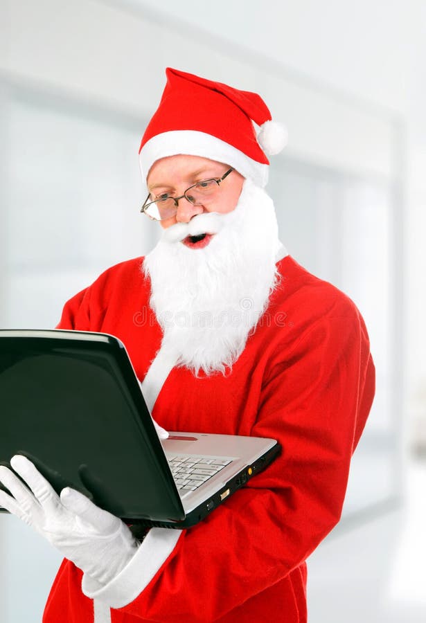 Santa Claus with Laptop stock photo. Image of coat, noel - 34746224