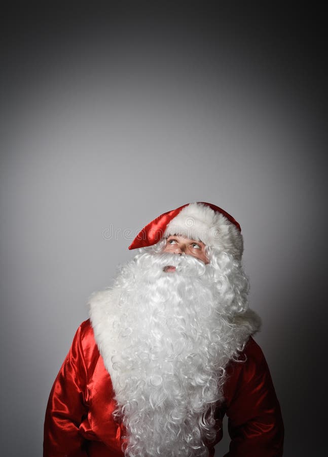Santa Claus is looking up stock image. Image of resolve - 64887955