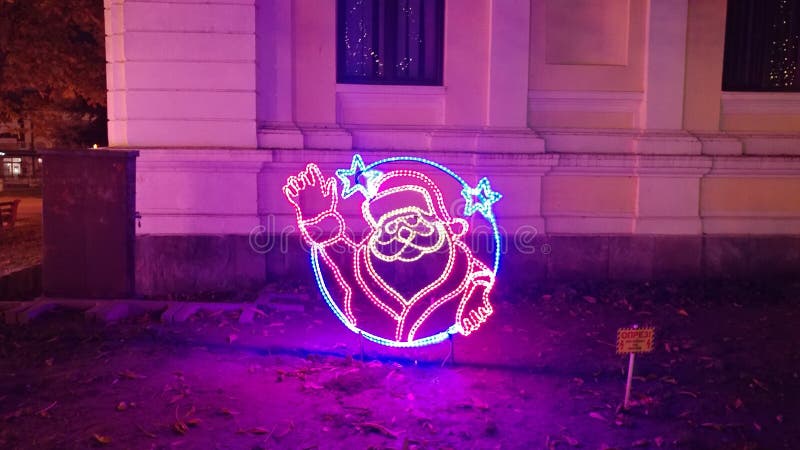 Santa Claus Made of Neon Lights in the Park Stock Photo - Image of ...
