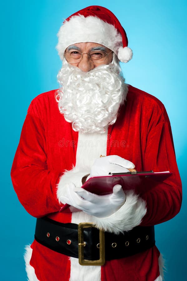 Santa Claus Making His List of the Good Children Stock Photo - Image of ...