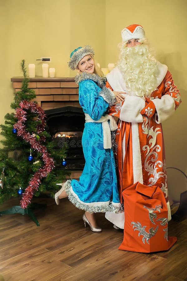 Santa Claus and Playful Snow Maiden Stock Image - Image of fire ...