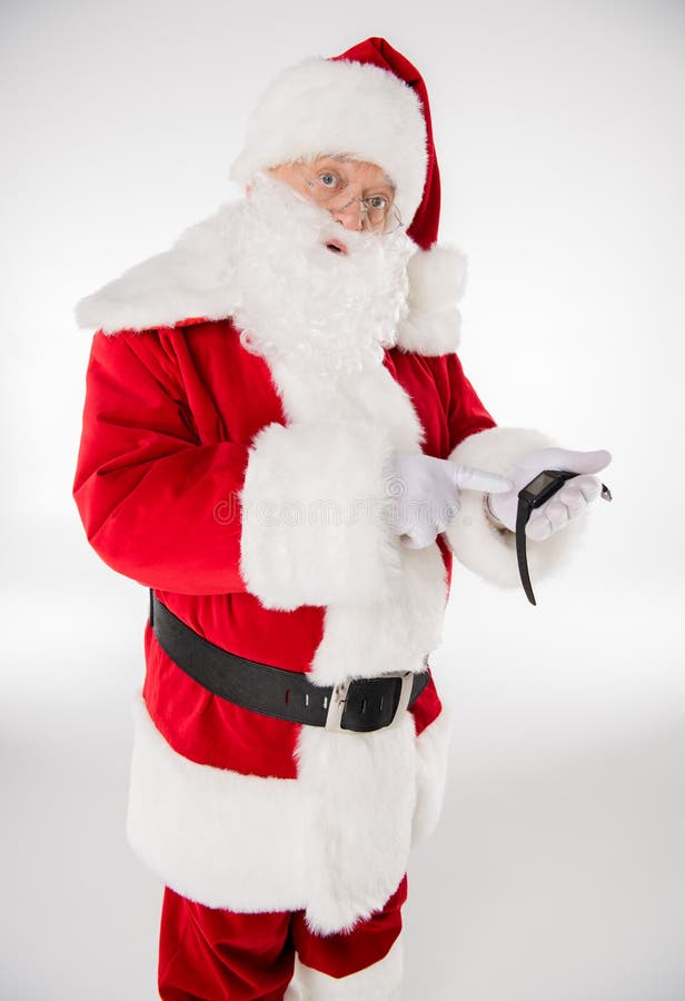 Santa Claus Pointing on Smartwatch Stock Photo - Image of santa ...