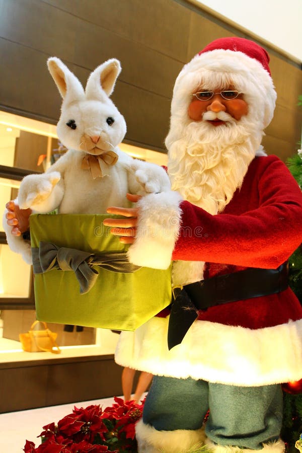 Santa Claus and Rabbit Gift Stock Photo - Image of yellow, cool: 48343078