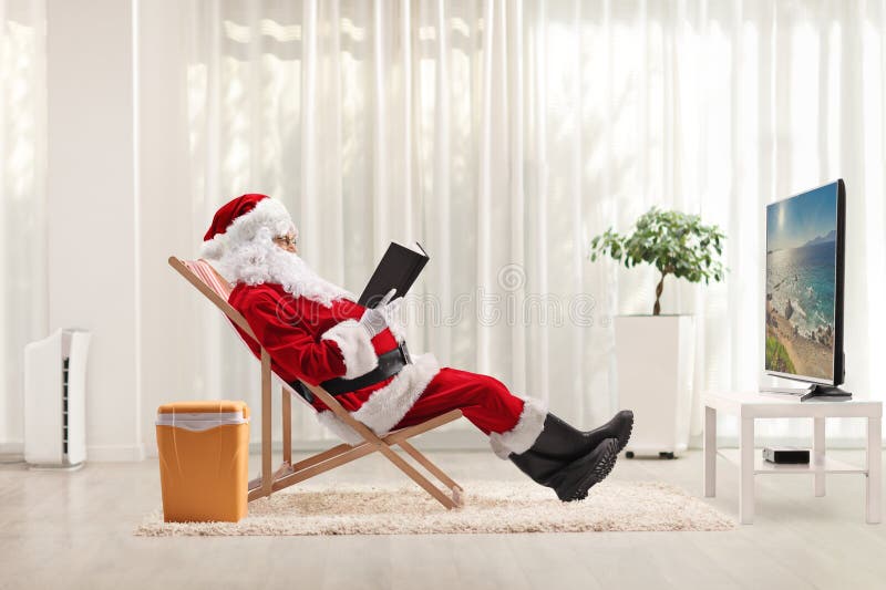 Santa Claus Reading a Book in Front of Tv Stock Photo - Image of claus ...