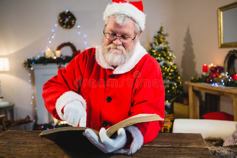 Santa Claus reading book stock photo. Image of tree - 101338782