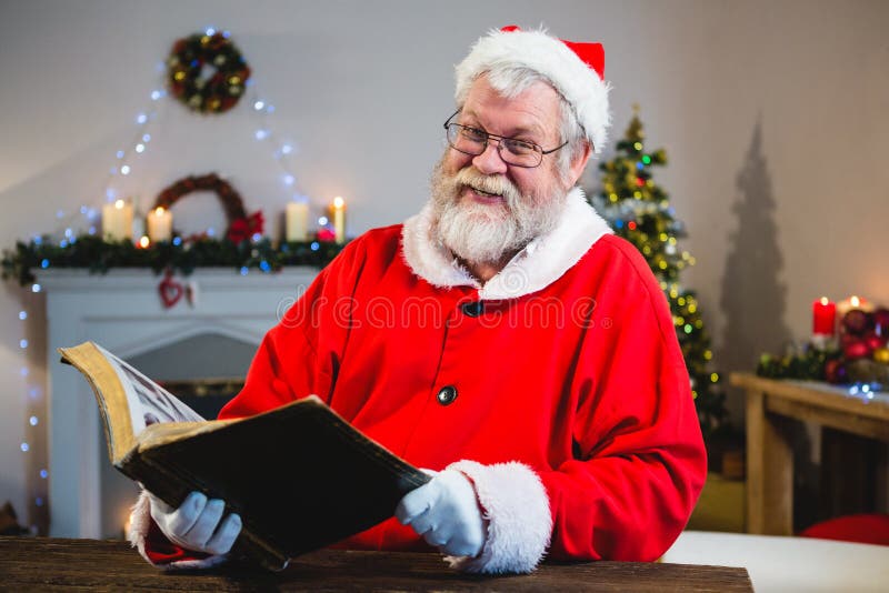 Santa Claus reading book stock image. Image of decoration - 103811529