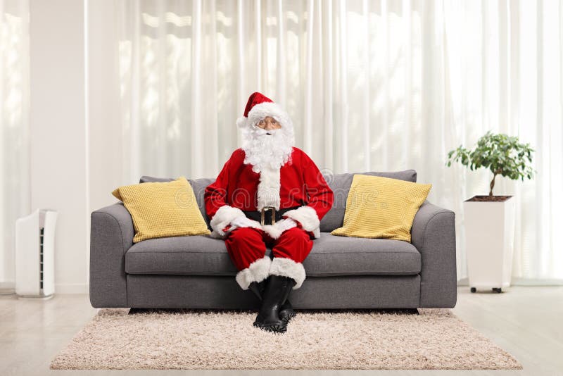 Santa Claus Resting on a Gray Sofa Stock Image - Image of home, company ...