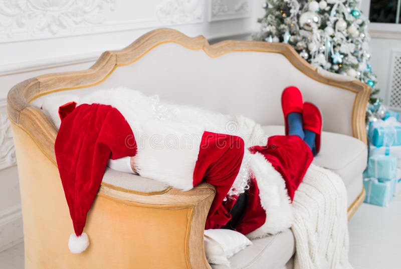 Santa Claus Resting on a Sofa at Home. Stock Photo - Image of lying ...