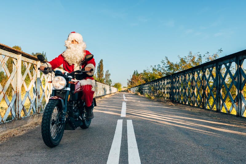 Santa Claus Riding a Motorcycle on the Road Stock Photo - Image of ...