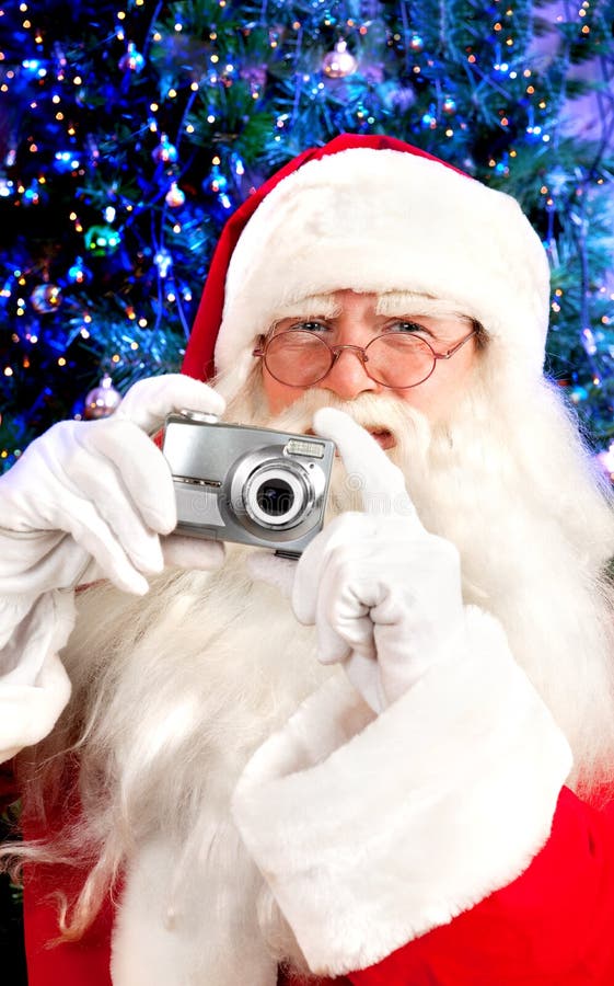 Santa Claus Shoots a Digital Camera Stock Image - Image of glove, santa ...