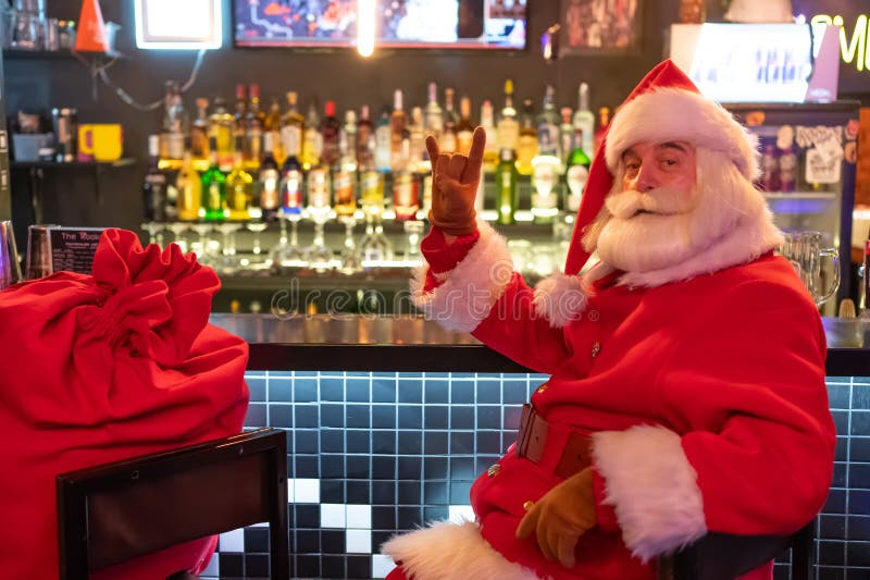 Santa Claus Sits at the Bar in a Pub. Stock Photo - Image of sits ...